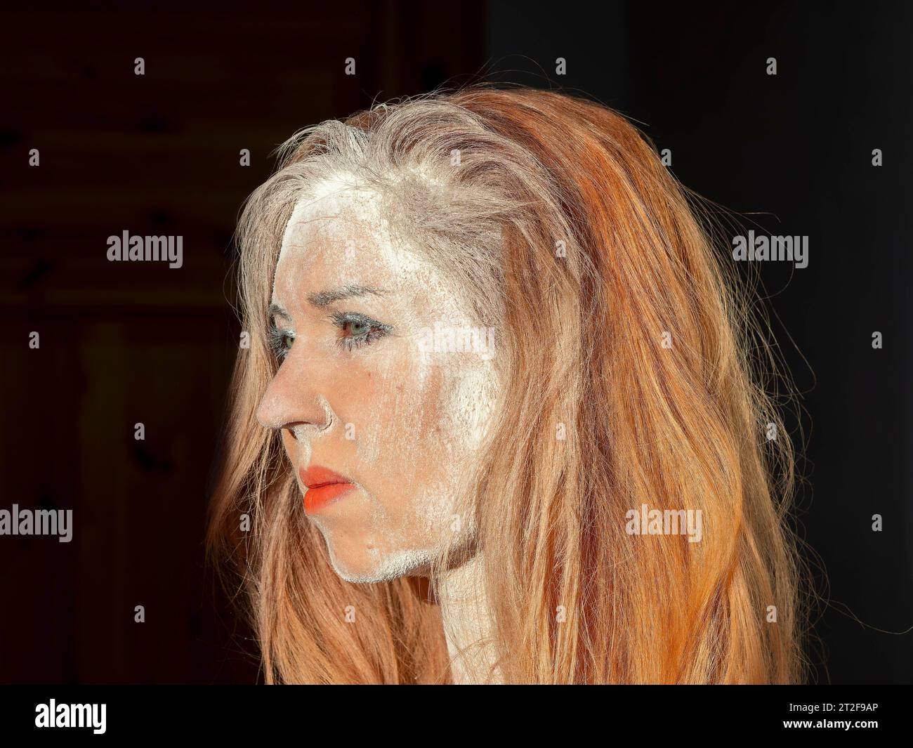 Woman with red lips, long hair, dusty face, drama, despair, suffering and war Stock Photo - Alamy