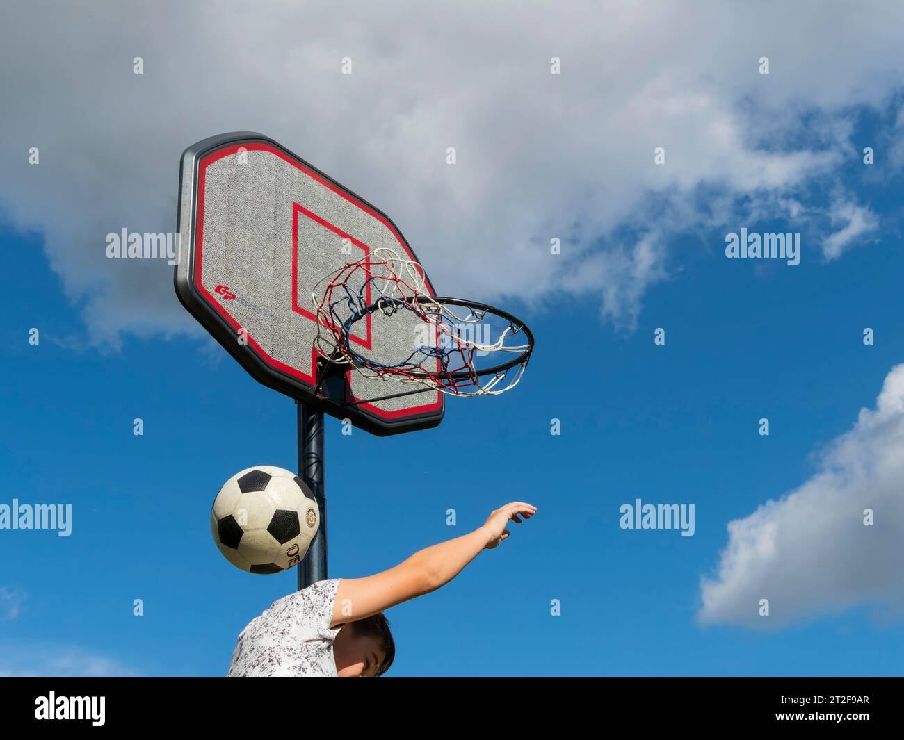 Basketball Jump with the ball to the basket and net, boy 13 years, sport activity with children ...