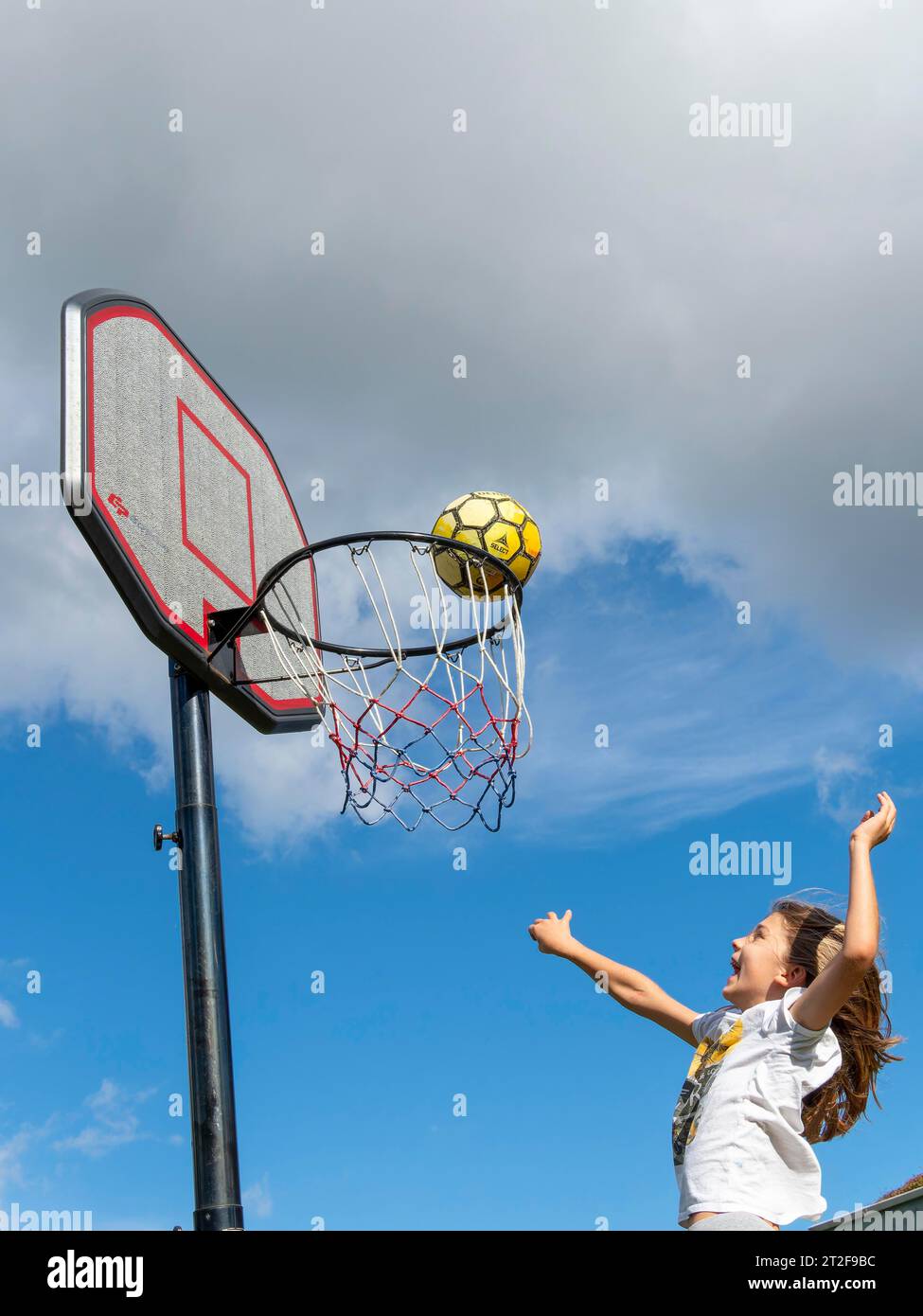 Basketball Jump with the ball to the basket and net, boy 10 years ...