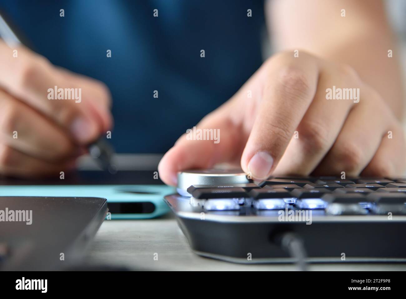 Designer working in office with digital control wheel and graphic ...