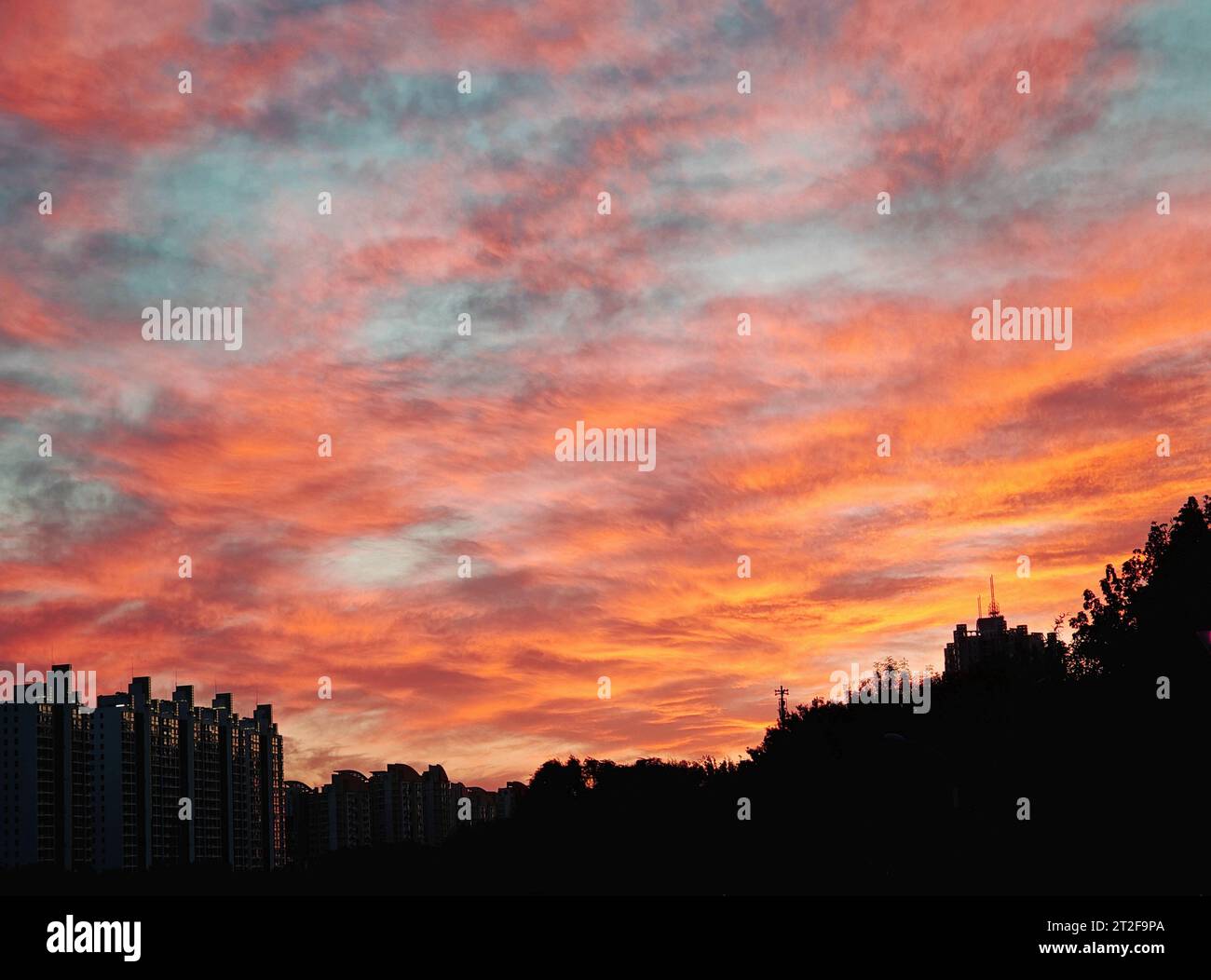 BEIJING, CHINA - OCTOBER 19, 2023 - An evening glow is seen at dusk in ...