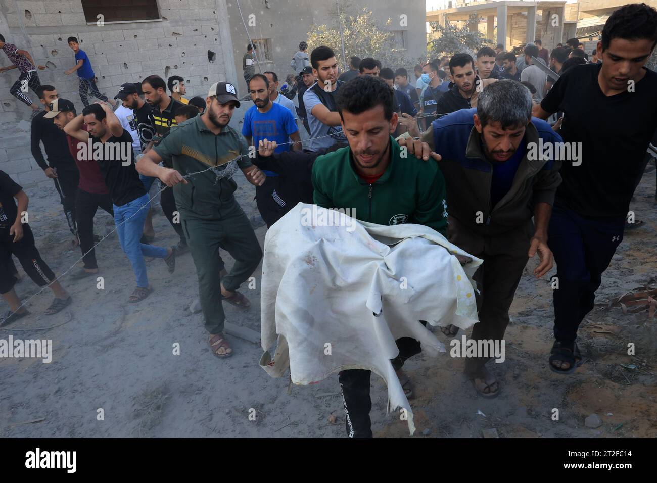 Rafah, Gaza. 19th Oct, 2023. A man carries away the body of Child ...