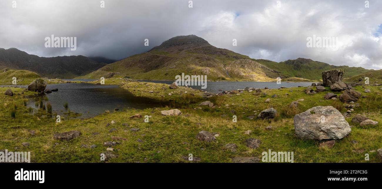 Lake Llyn Llydaw with Mount Snowdon behind clouds in late summer ...