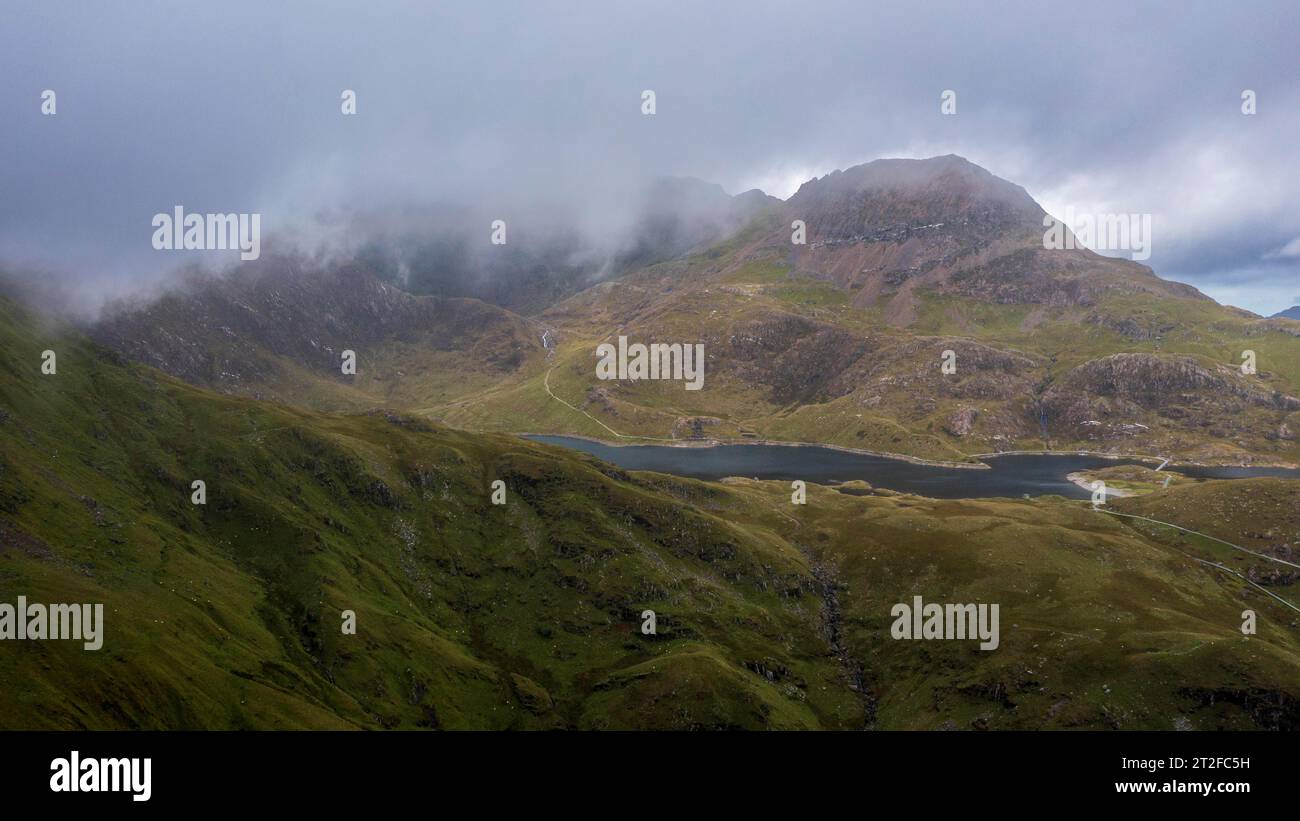 Typical landscape with Snowdon behind clouds in late summer, Snowdonia ...