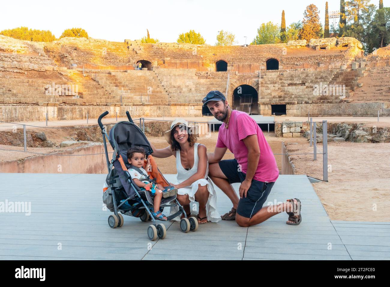 Roman Ruins of Merida, a tourist family visiting the Roman Amphitheater ...