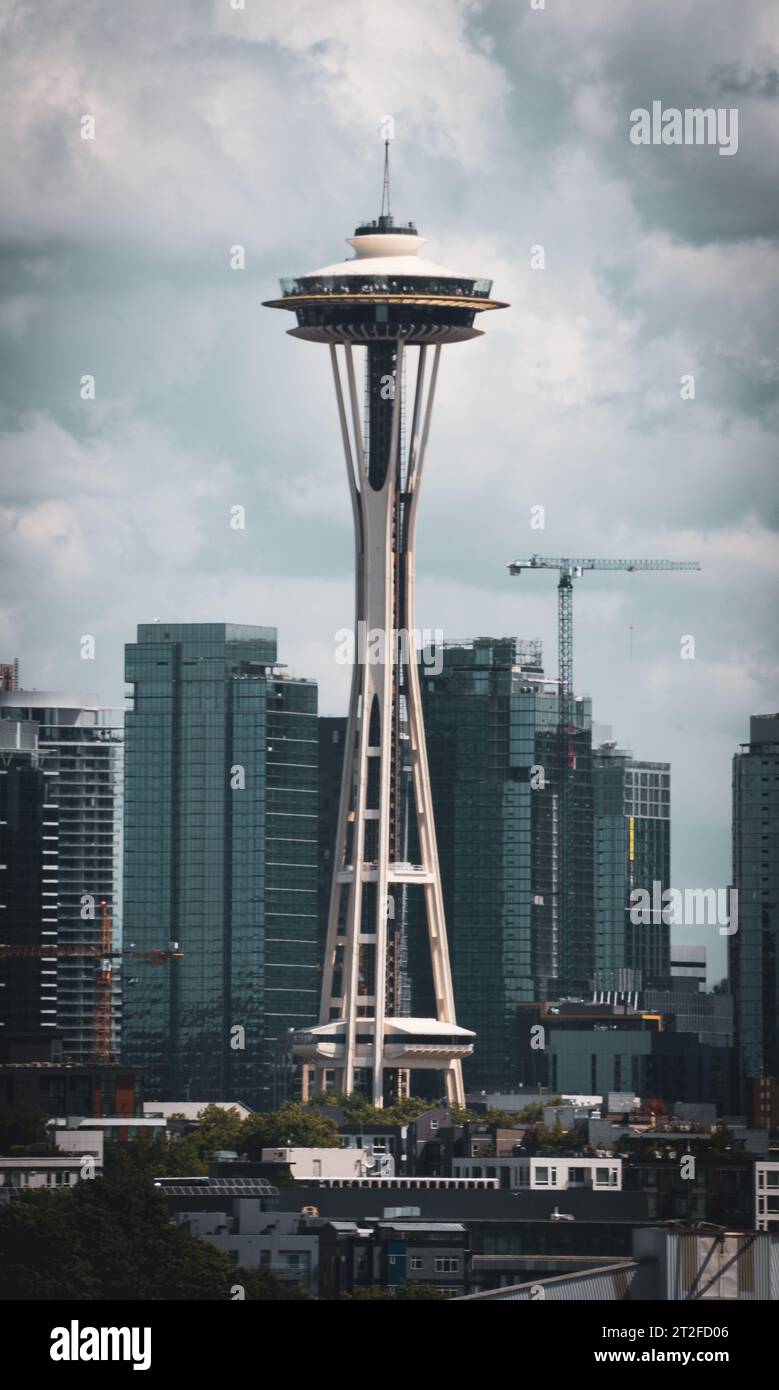 Vertical shot of the Space Needle and some buildings in downtown ...