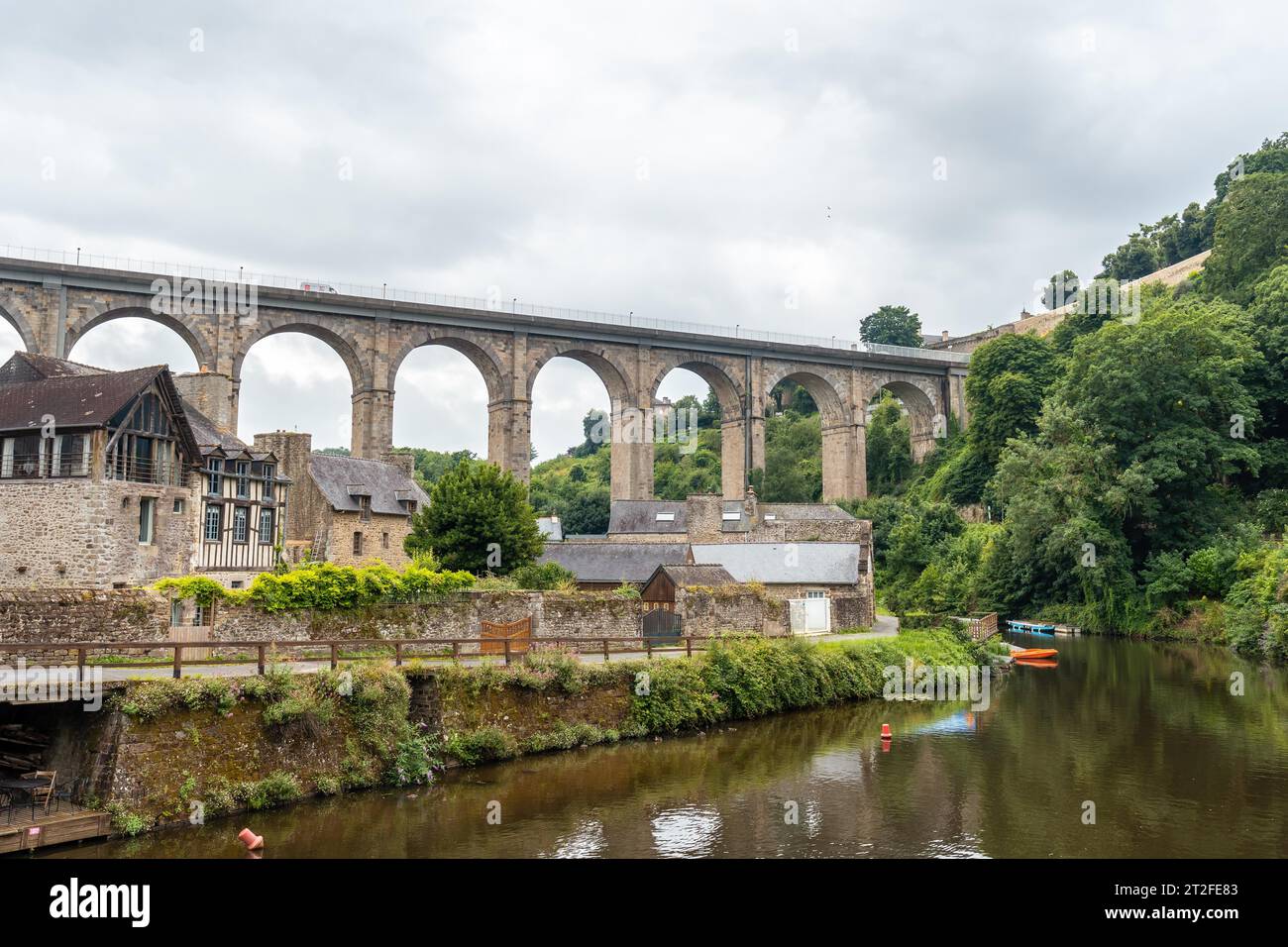 Houses and boats on the Rance river in Dinan medieval village in French ...