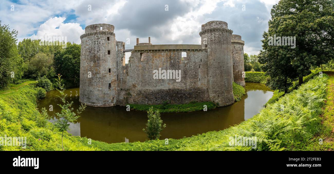 Ramparts and water surrounding the medieval Hunaudaye Castle, French ...