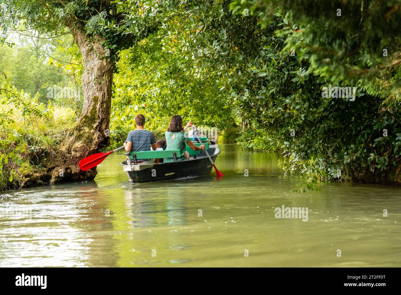 A young couple rowing the boat sailing between La Garette and Coulon ...