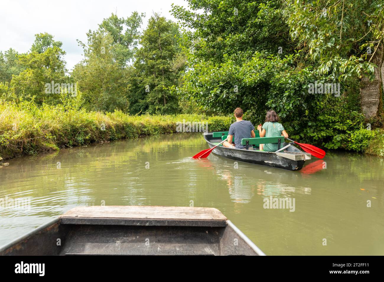 A young couple rowing the boat sailing between La Garette and Coulon ...
