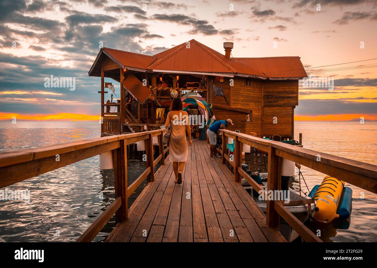 Roatan, Honduras Â», January 2020: A young woman walking at sunset in ...