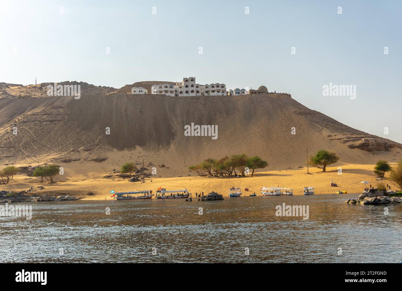 A Nubian village atop a desert sand mountain on the Nile River and near ...