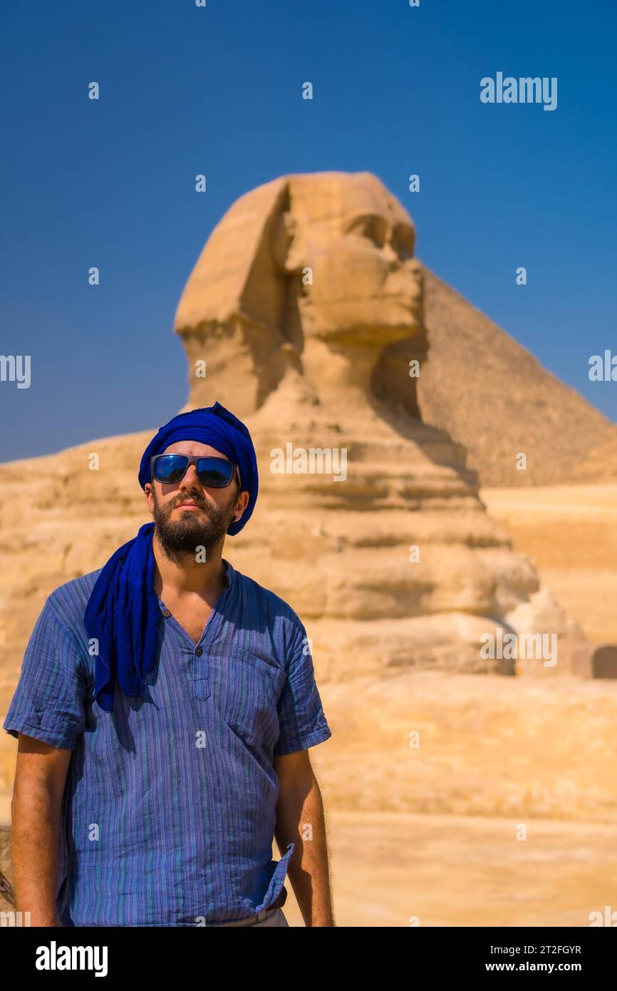 Portrait of a young tourist dressed in blue and a blue turban at the ...