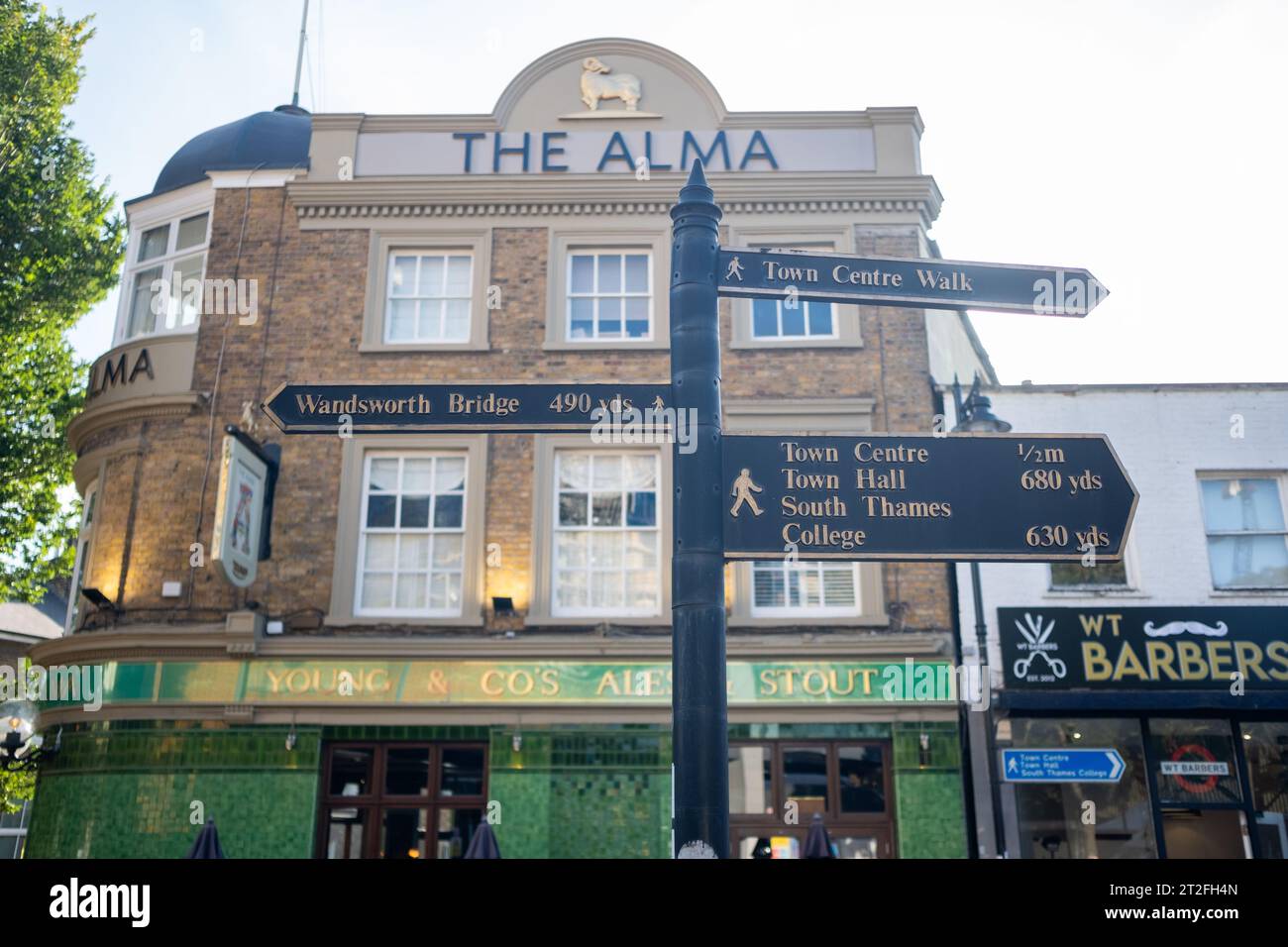 London- October 10, 2023: Sign post and the Alma pub on Old York Road ...