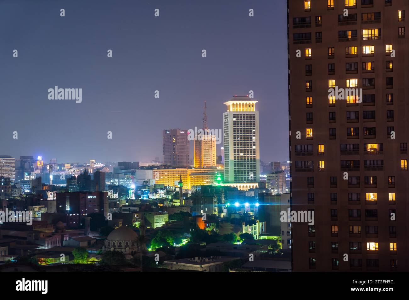 Aerial view of the city of Cairo at night along the river Nile. Skyline ...