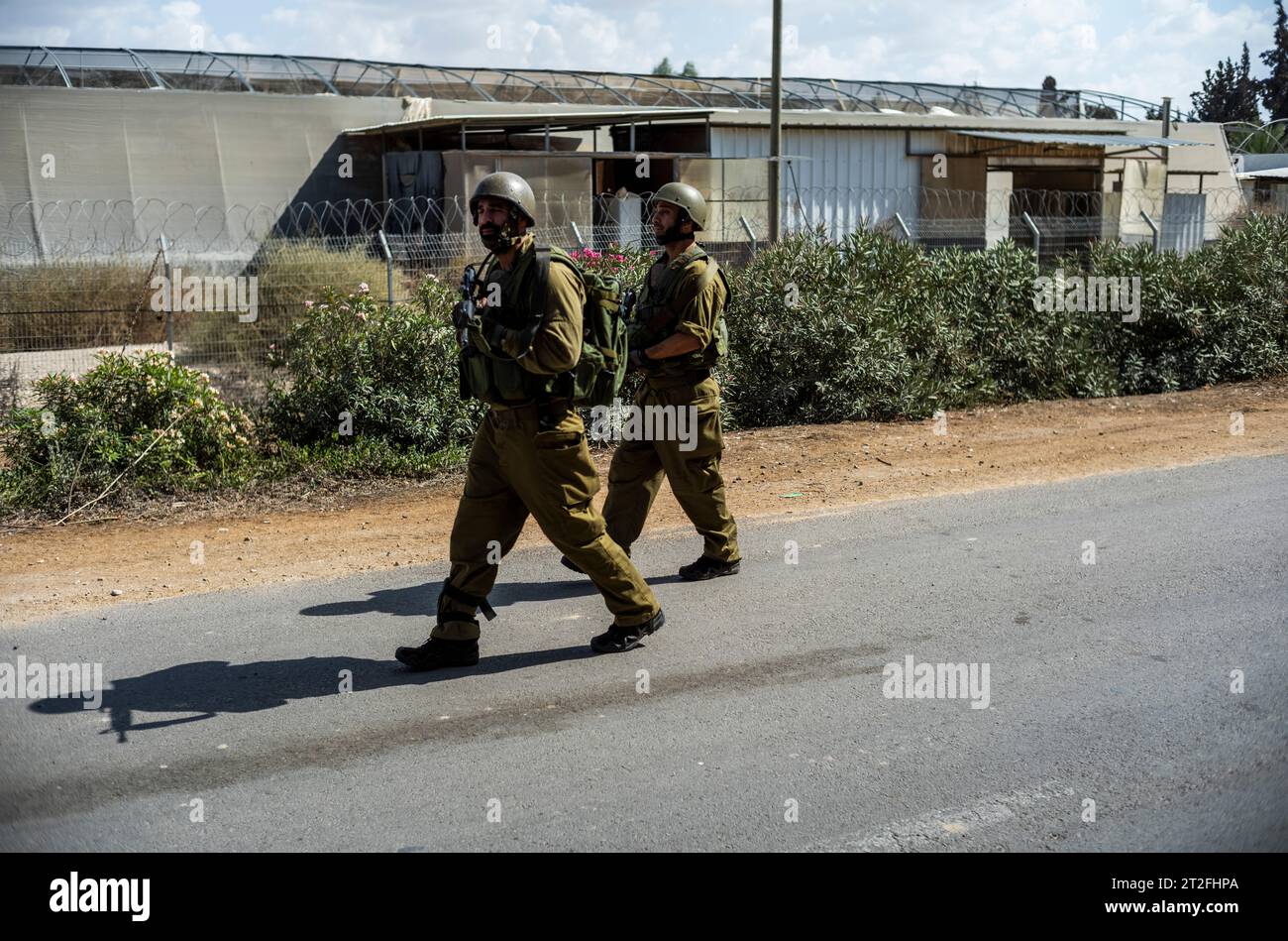 Nir Oz, Israel. 19th Oct, 2023. Israeli soldiers patrol an area in the ...