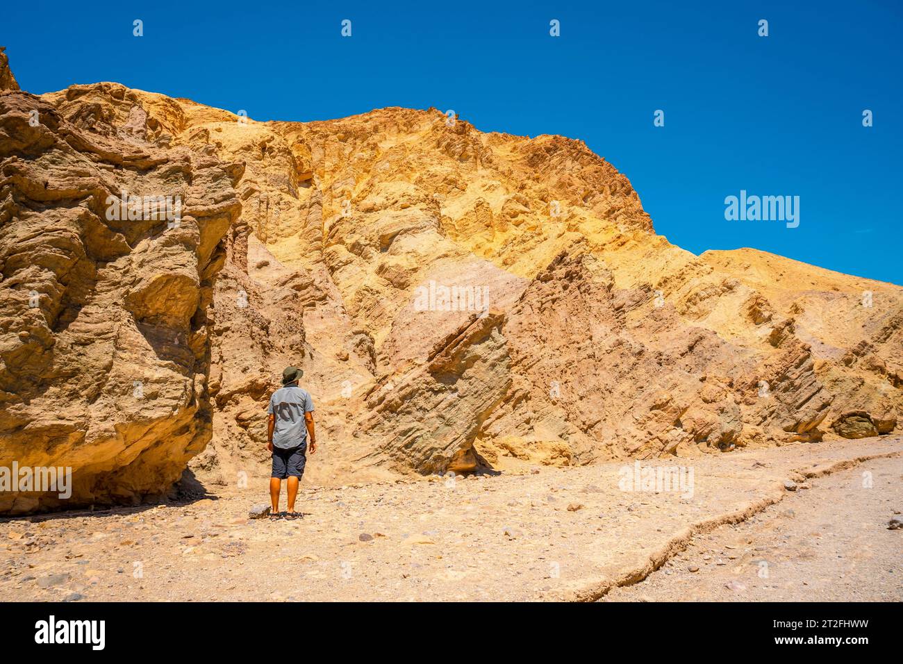 A man on the Golden Canyon trail enjoying the surrounding colors ...