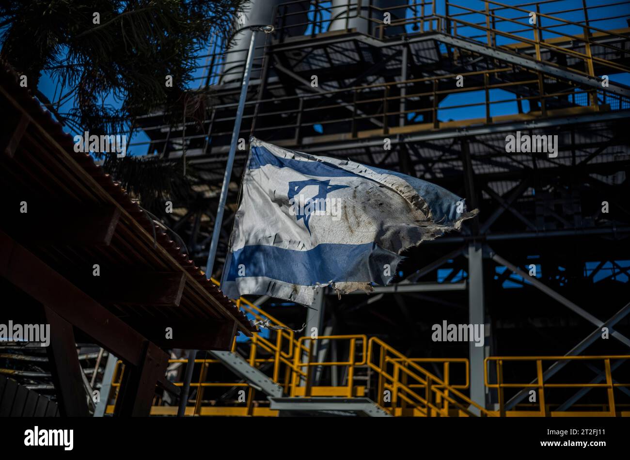 Nir Oz, Israel. 19th Oct, 2023. A view of a ripped Israeli flag ...
