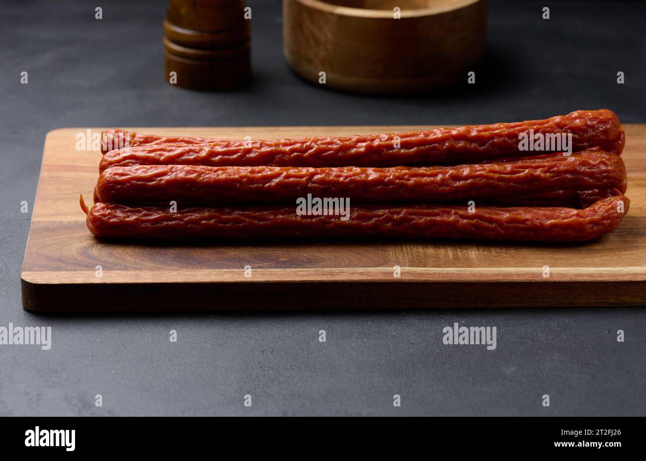 Traditional Polish thin smoked sausages on a black background Stock ...