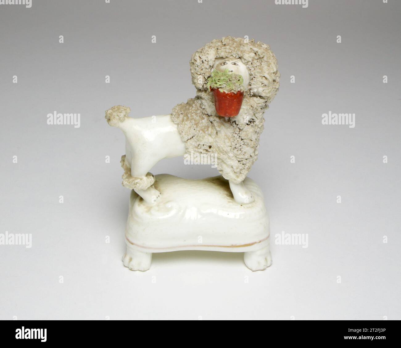 Antique 19thc. Staffordshire pottery poodle dog with basket of flowers ...