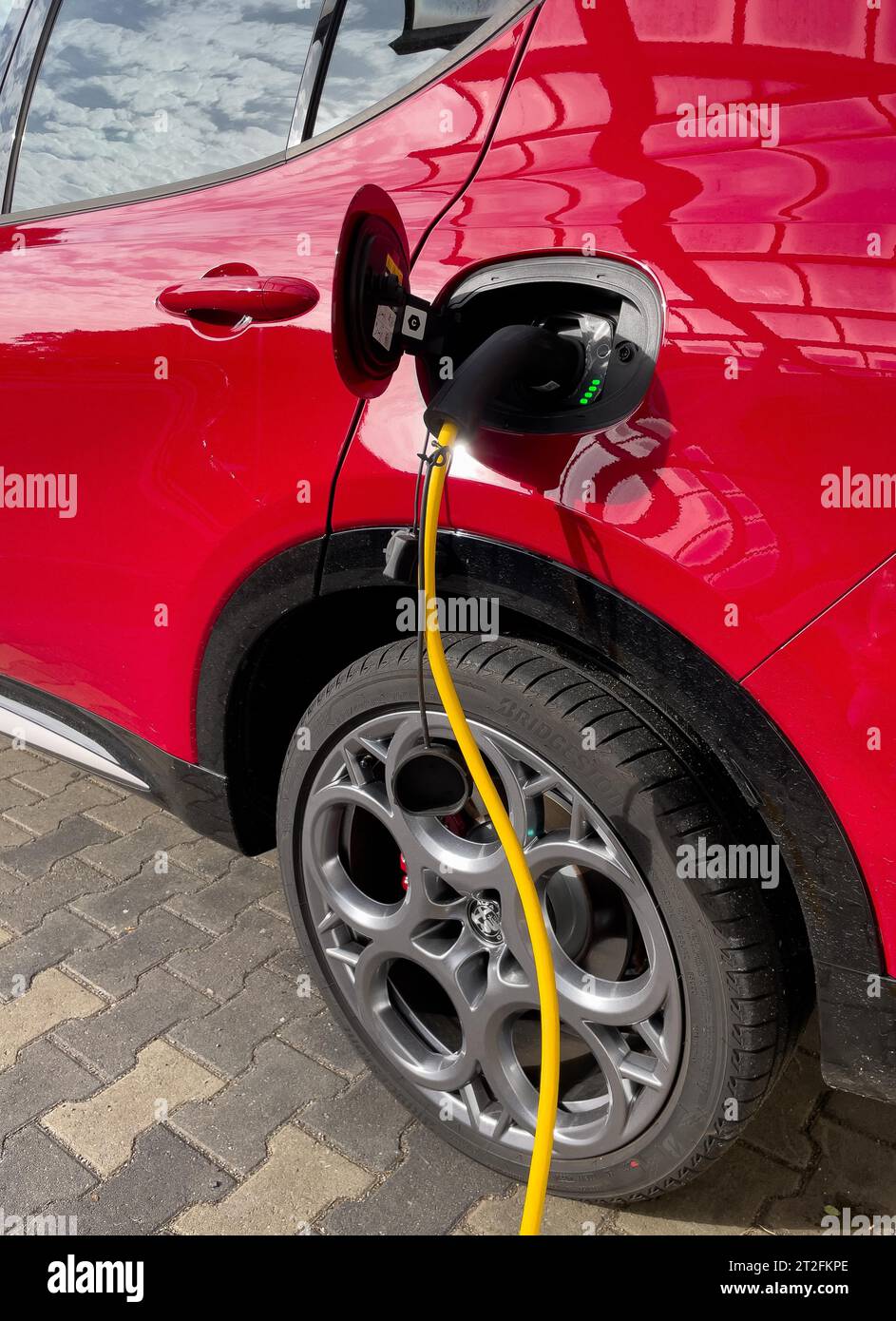 Red eco-friendly e-car electric powered car vehicle brand Alfa Romeo is ...