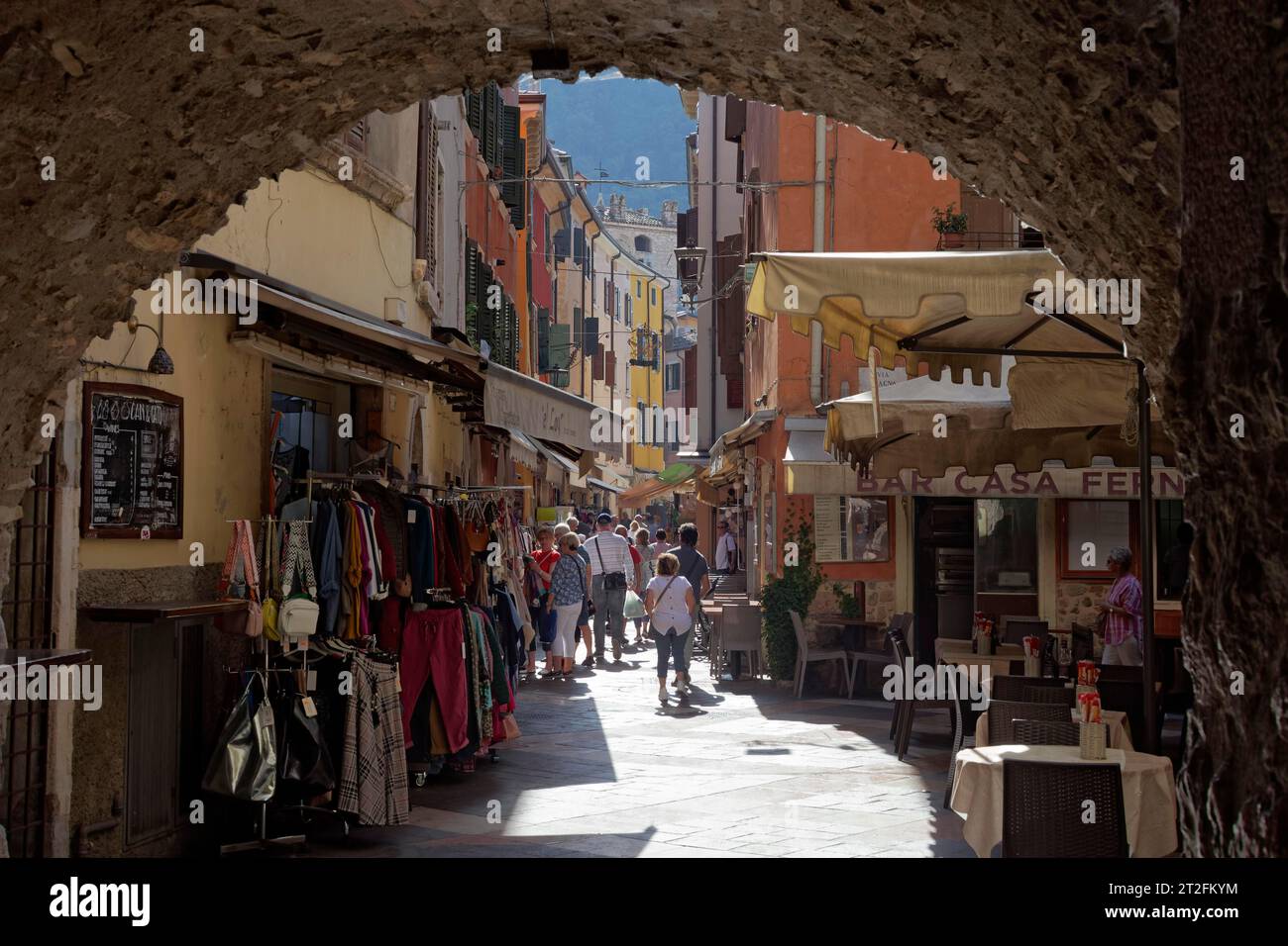 Old town alley with shops, tourists shopping, Garda, Lake Garda, Veneto ...