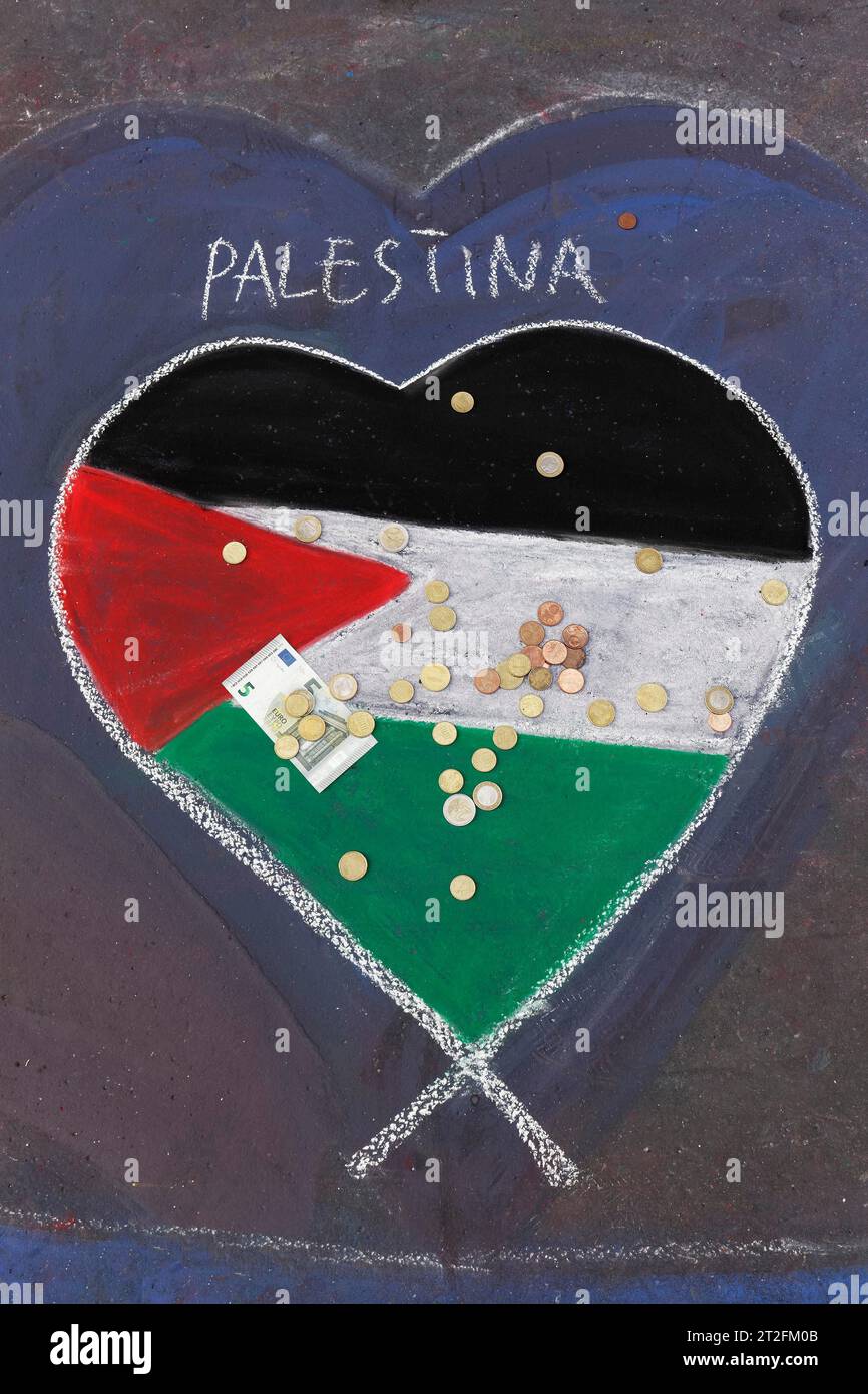 Palestinian flag painted as a heart on the street, with coins and ...