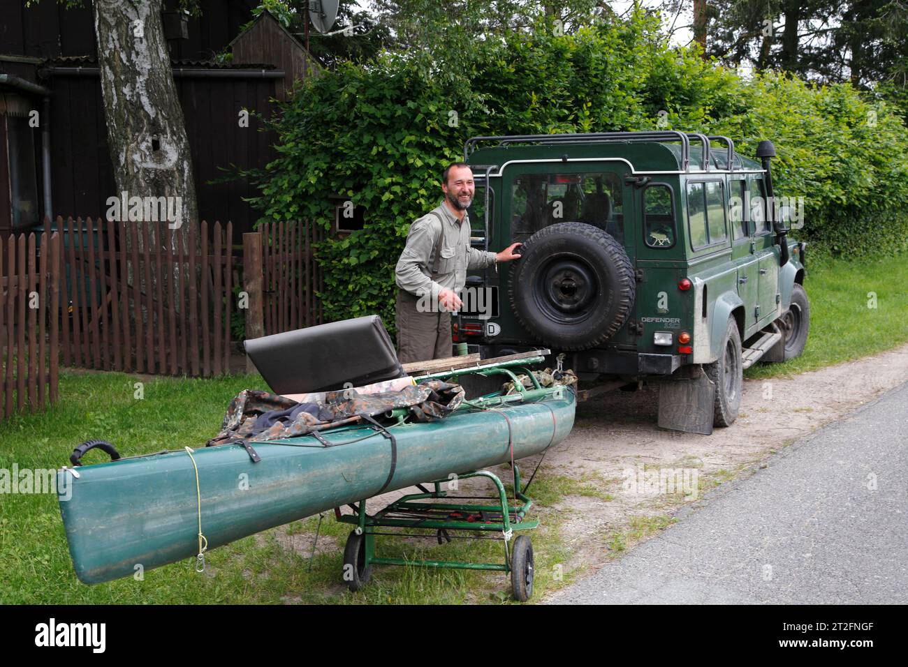 Transporting a boat with a car, car towing a trailer, Peene Valley ...