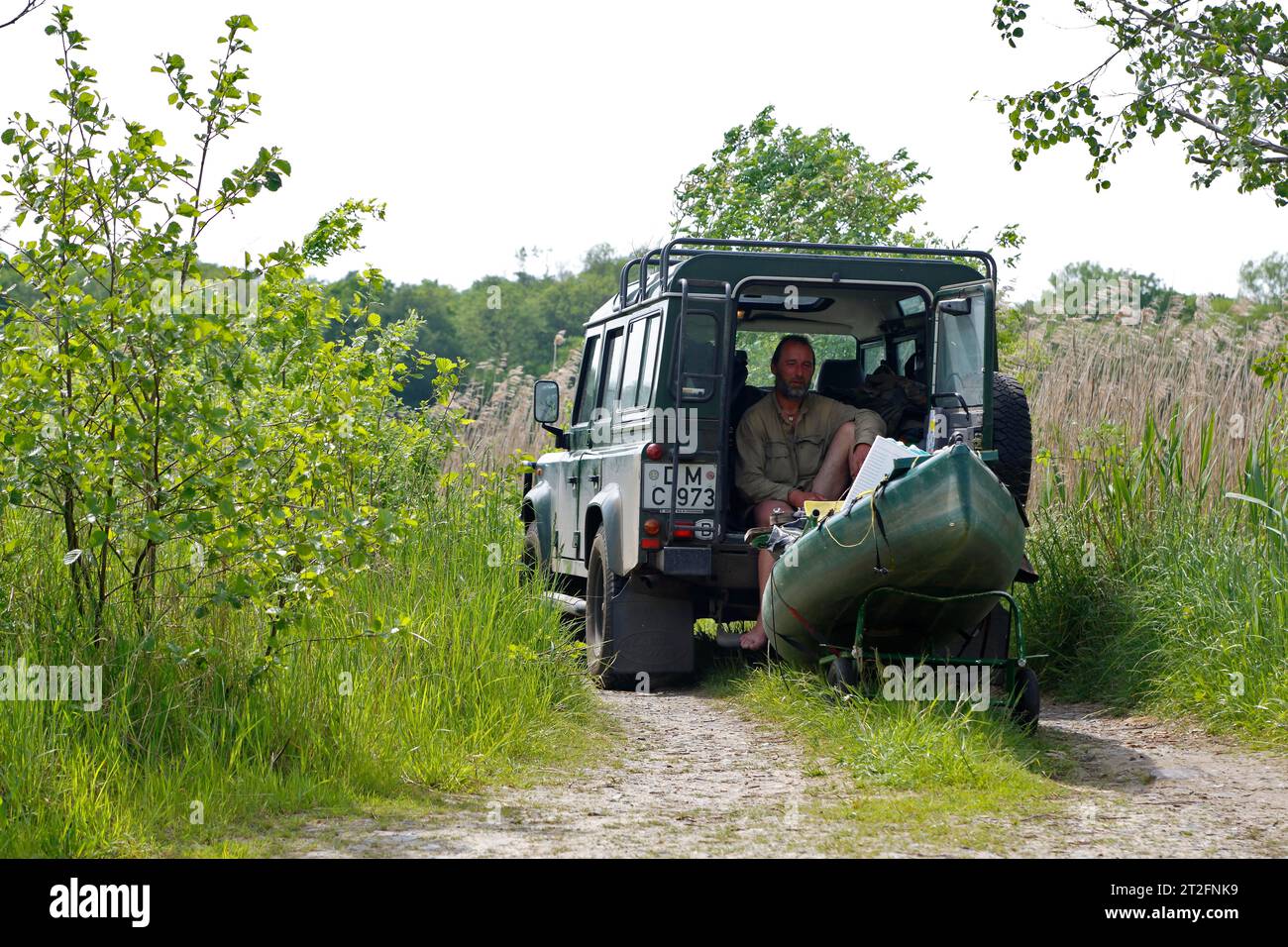 Transporting a boat with a car, car towing a trailer, Peene Valley ...