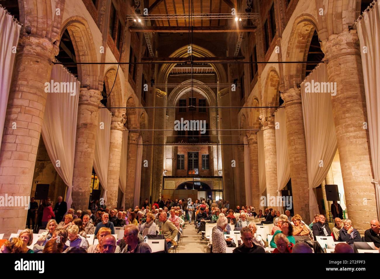 visitors of a concert in the church Grote Kerk Onze-Lieve-Vrouwekerk in ...