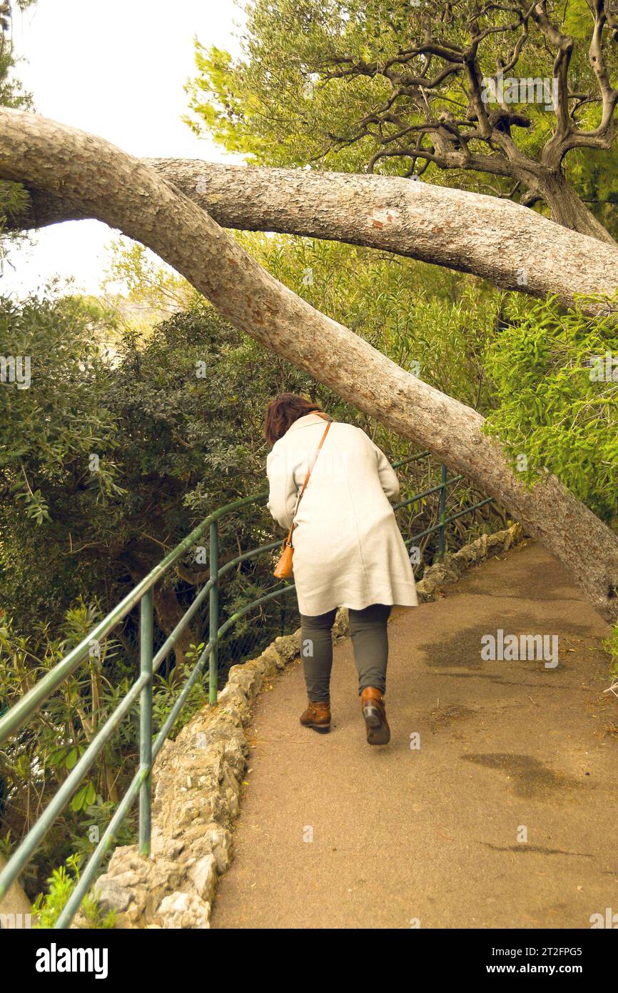 Monaco, Europe - January 2018: Person bending down to pass under a ...