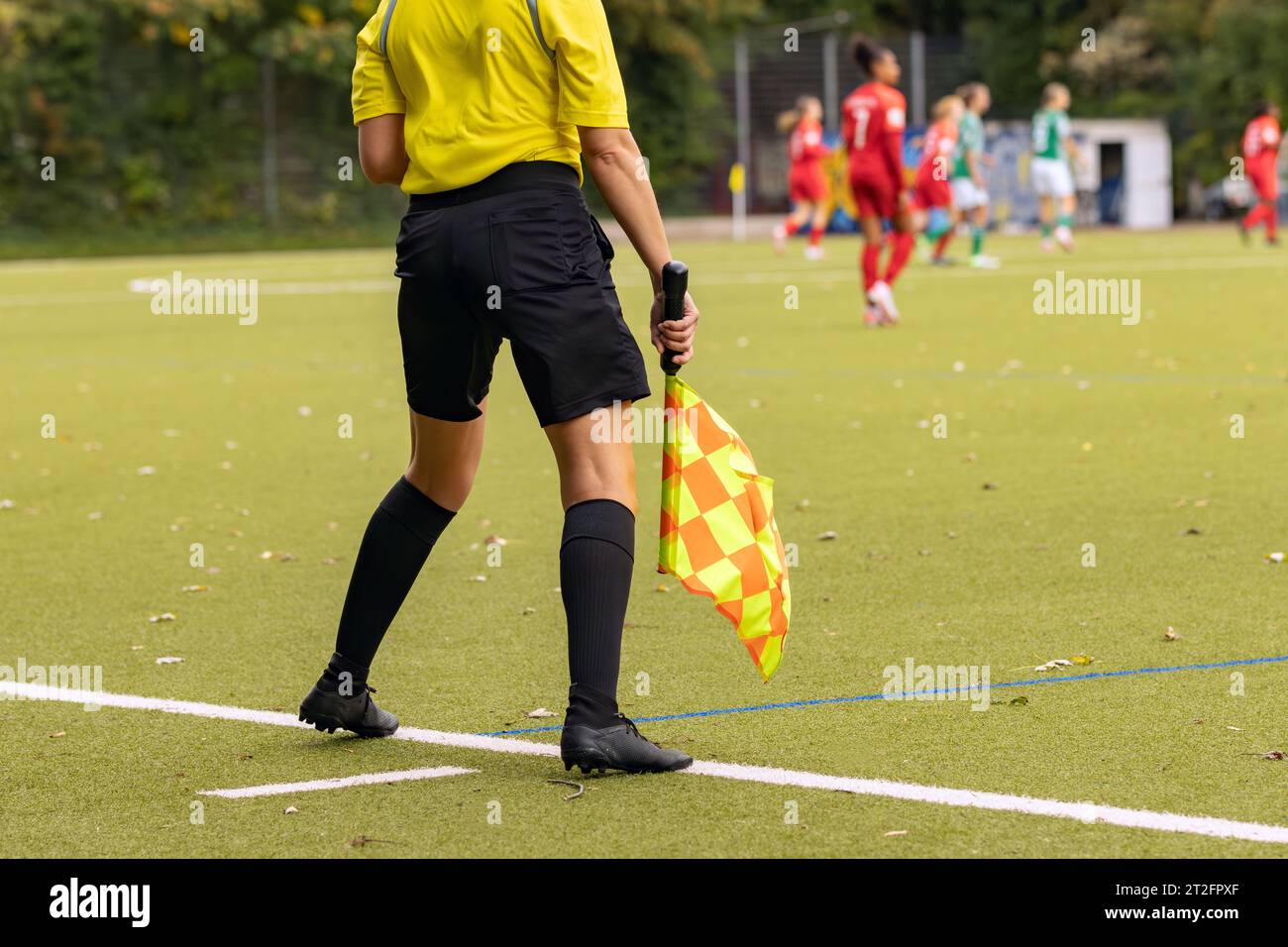 Line judge at a women's soccer game Stock Photo - Alamy