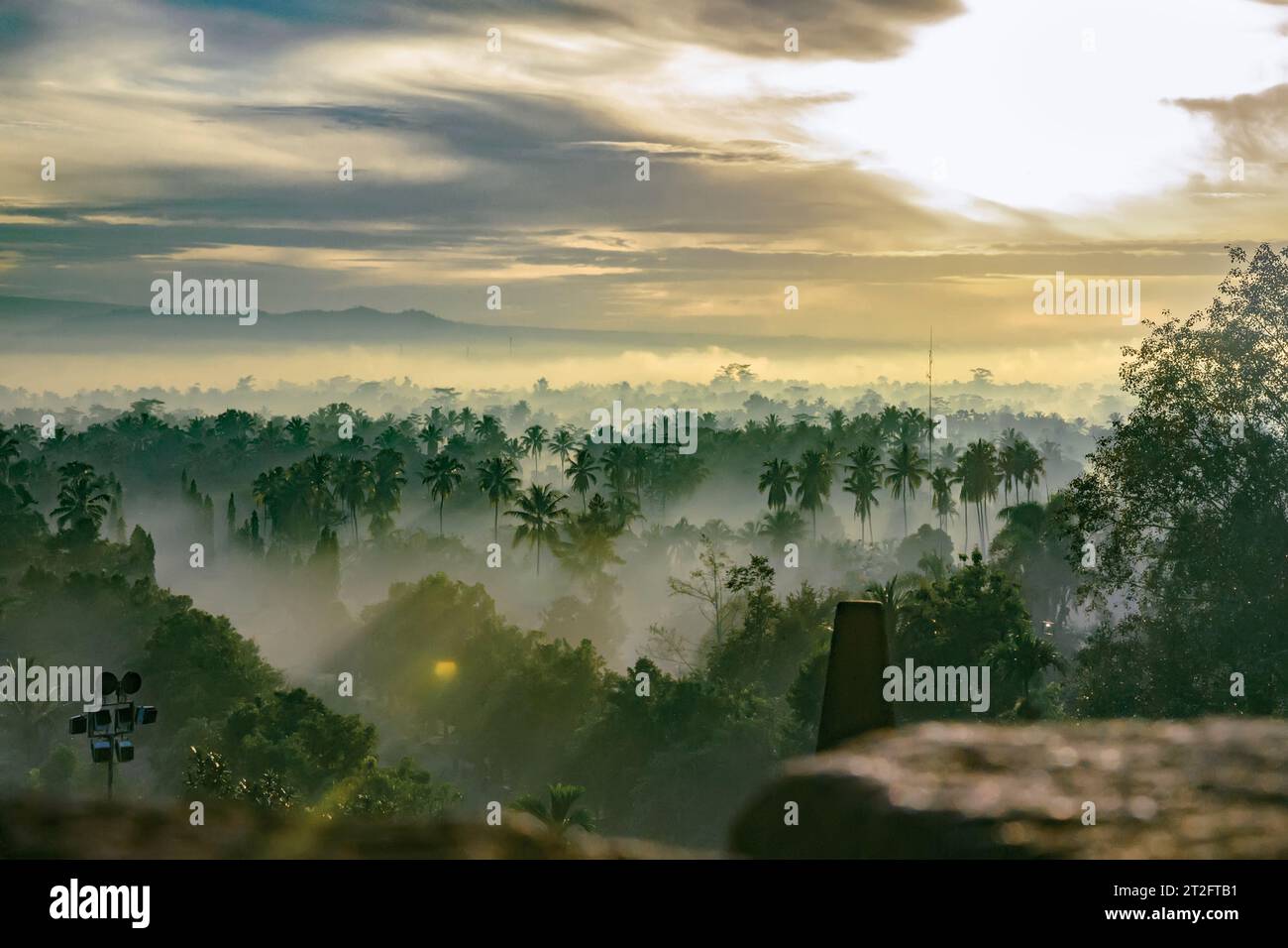 Sunrise over the ancient temple complex of Borobudur on the island of ...