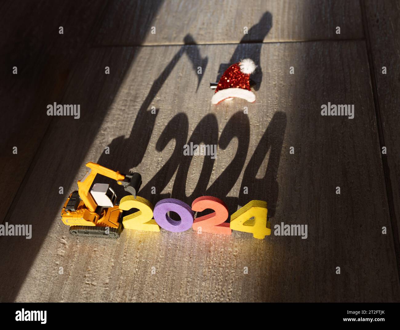 toy model of a construction excavator, numbers 2024 and a contrasting ...