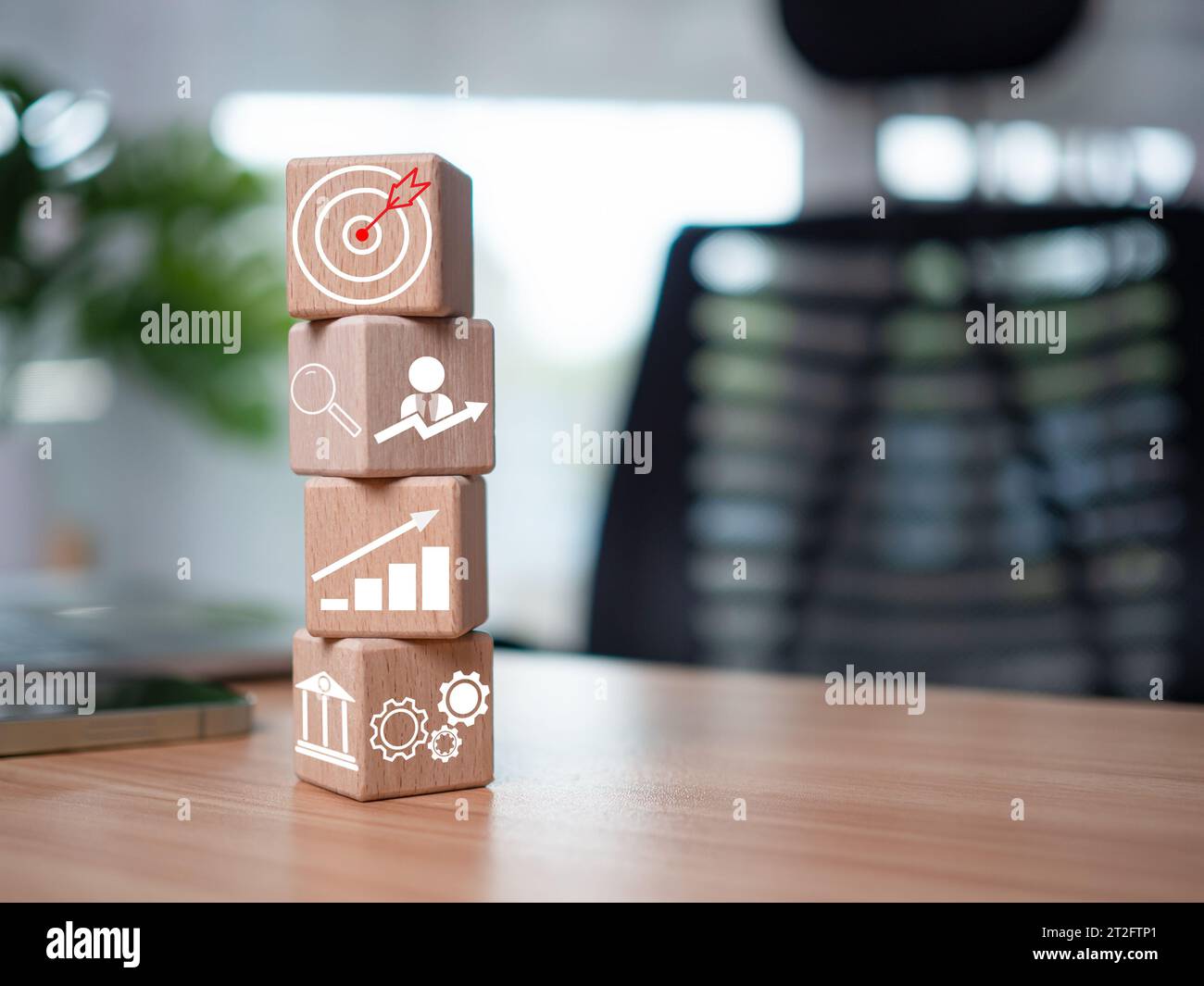 Wooden blocks and business icons on table wood represent the concept of ...