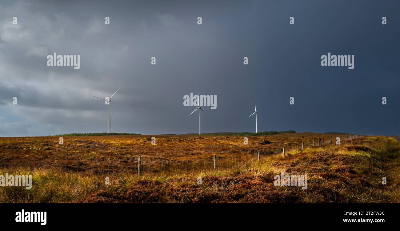 Wind turbines on a hilltop from the A858 on the Island of Lewis, Outer ...