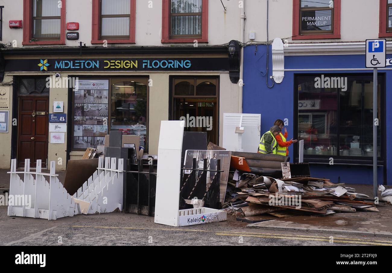 The clean up gets under way on Main street in Midleton, Co Cork ...