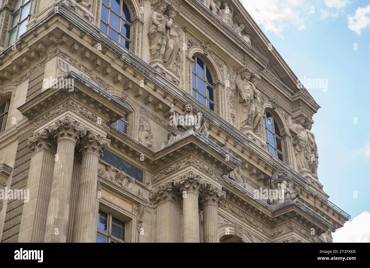 Louvre Palace facade with statues and columns. PARIS - 29 APRIL,2019 ...