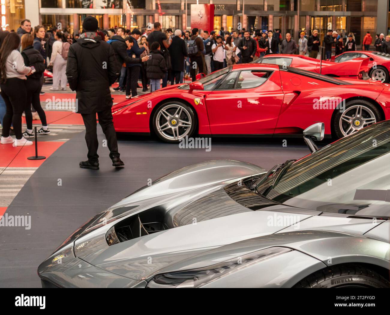 Sportscar aficionados drool over a display of Ferrari vehicles in ...