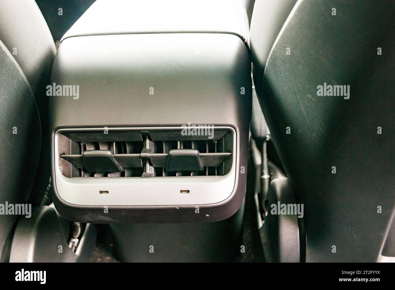 Rear air vents and USB chargers of a made in China Tesla Model Y on a ...