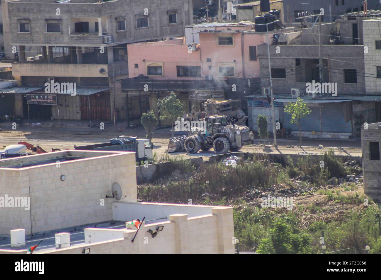 Tulkarm, Palestine. 19th Oct, 2023. Israeli armored military vehicles ...