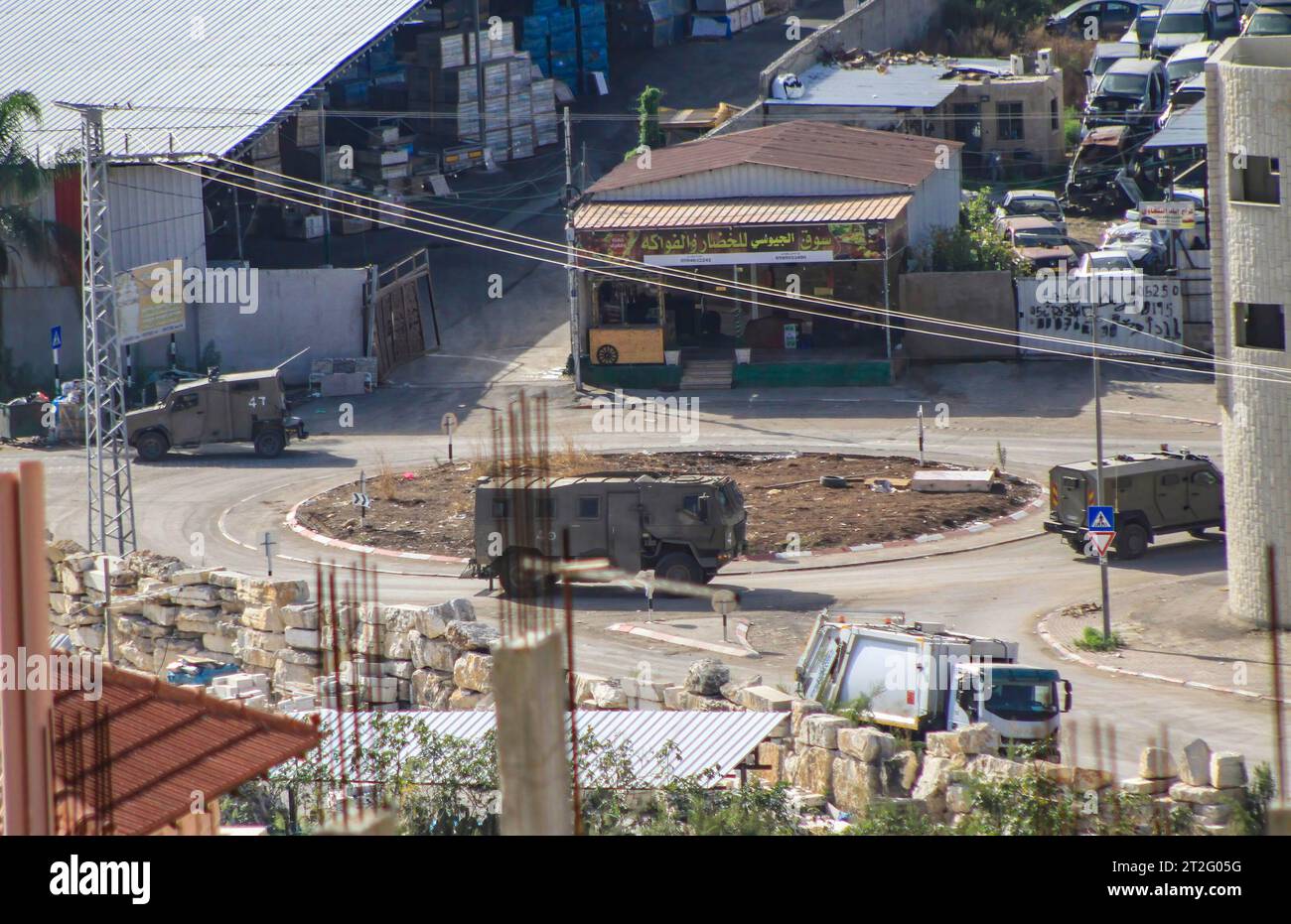 Tulkarm, Palestine. 19th Oct, 2023. Israeli armored military vehicles ...