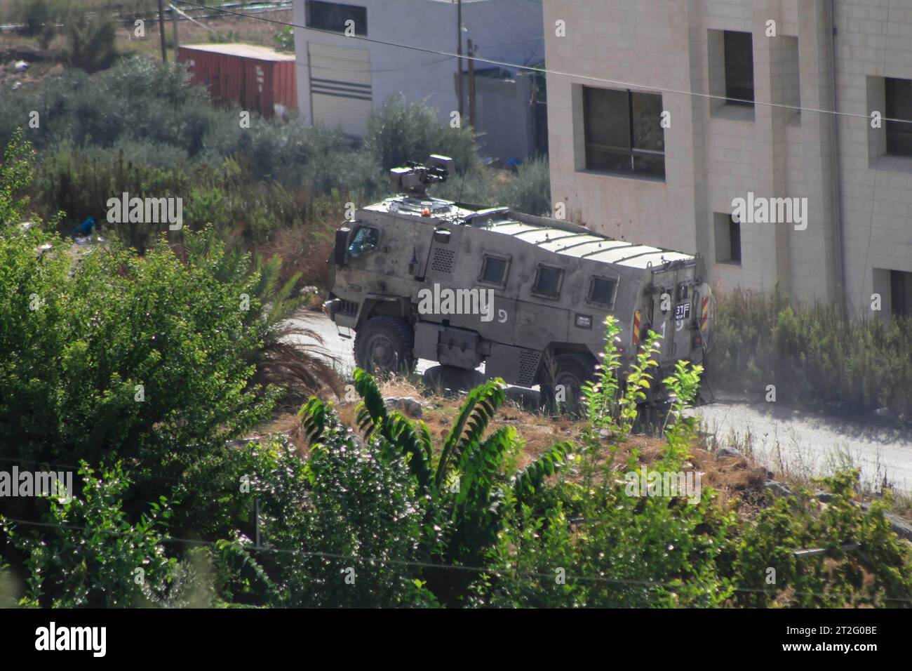 Tulkarm, Palestine. 19th Oct, 2023. An Israeli armored military vehicle ...
