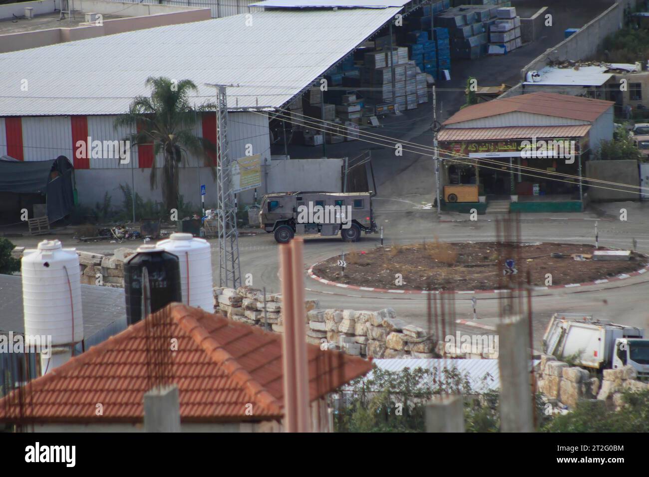 Tulkarm, Palestine. 19th Oct, 2023. An Israeli armored military vehicle ...