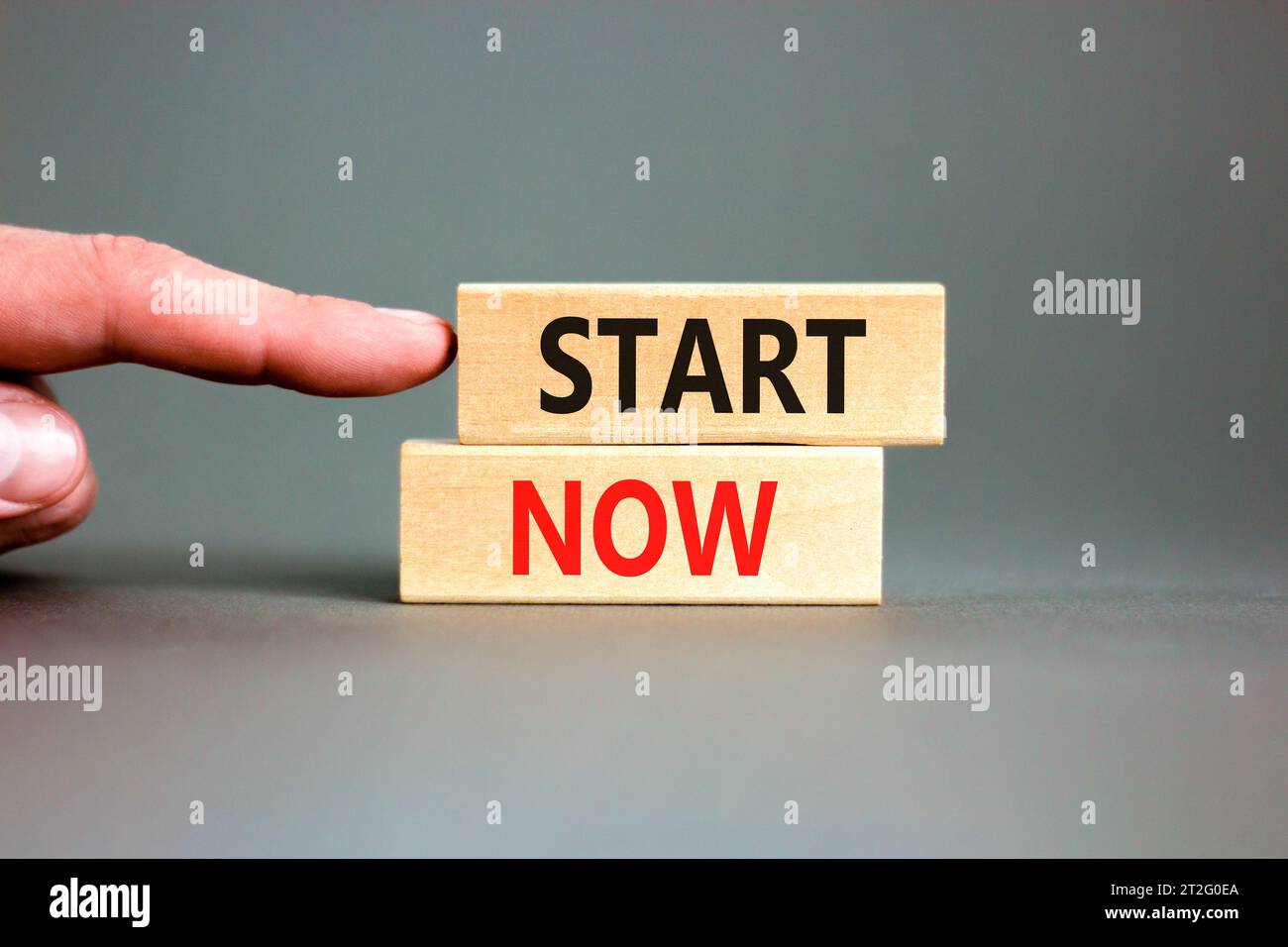 Start now symbol. Concept words Start now on beautiful wooden block ...