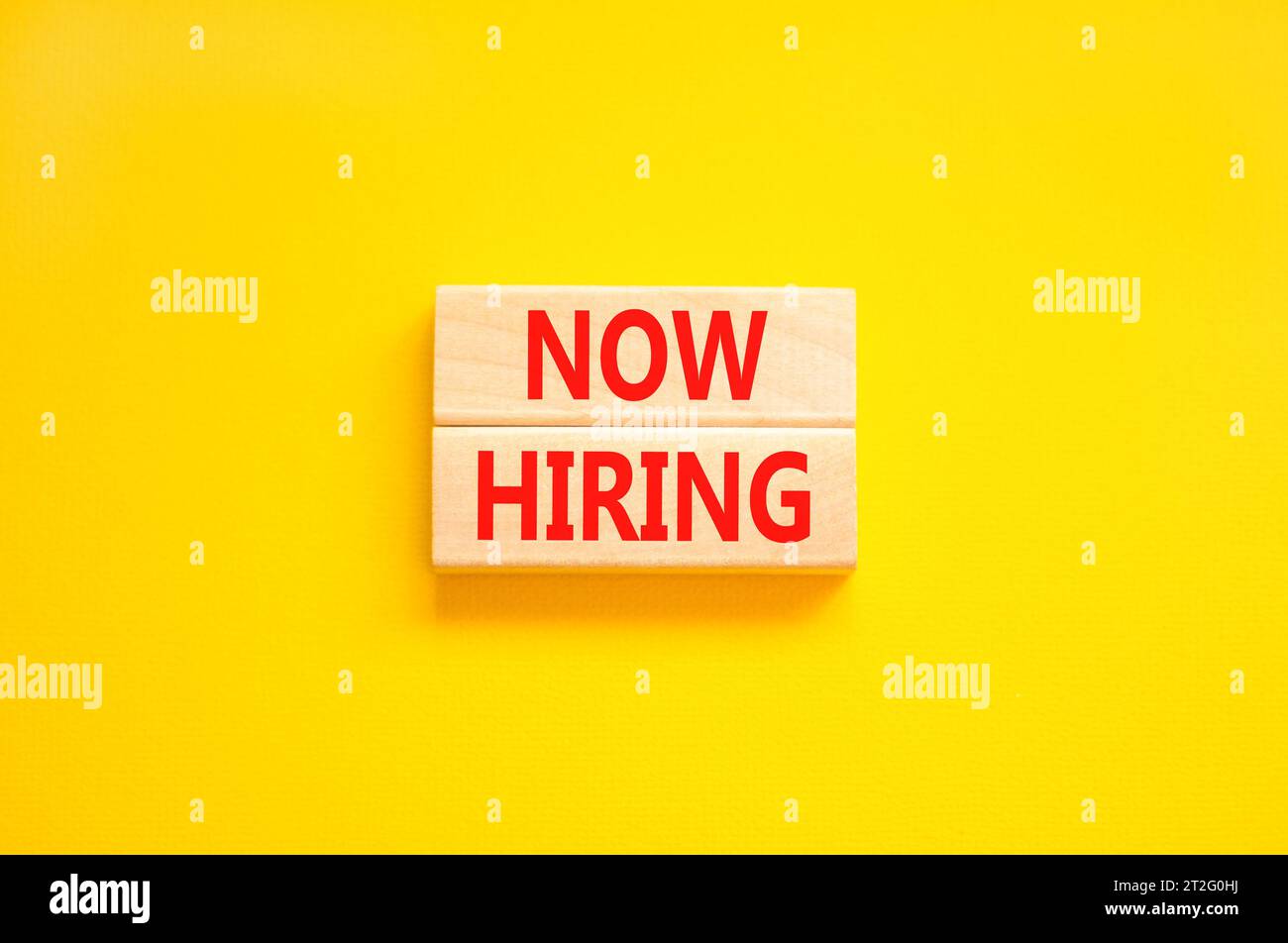 Now hiring symbol. Concept words Now hiring on beautiful wooden block ...