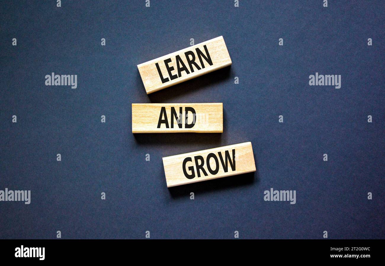 Learn and grow symbol. Concept word Learn And Grow on beautiful wooden ...