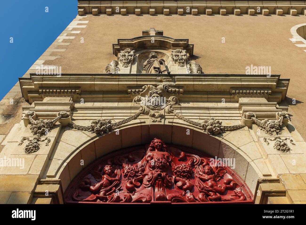 Angers, France, 2023. The curved pediment and richly carved wood ...