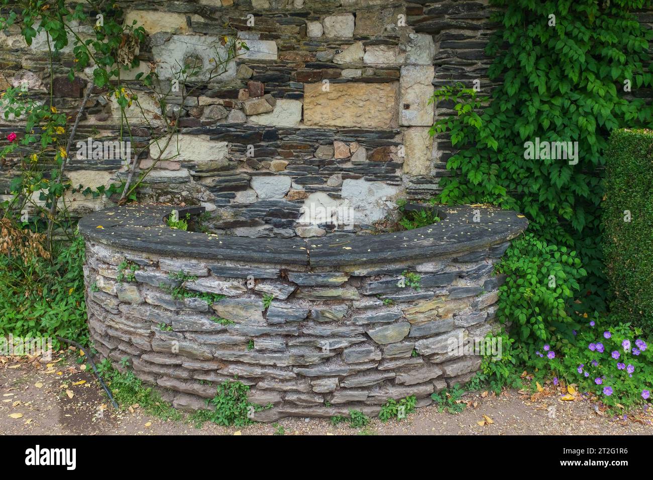Angers, France, 2023. The old slate well in the gardens of the Château ...