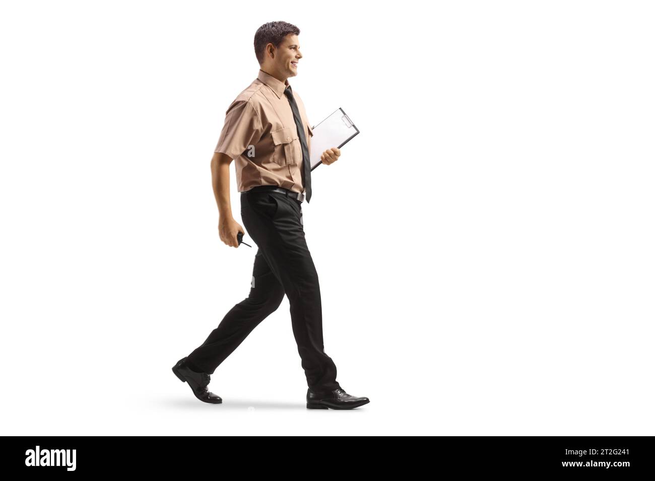 Full length profile shot of a security guard holding a clipboard and ...